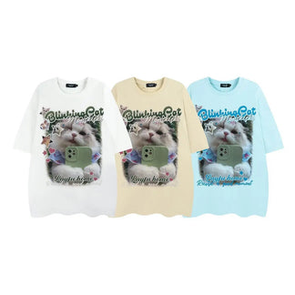 Steal the Show with Y2K Cat Graphics | Blinking Cat T-Shirt – Meowgicians™